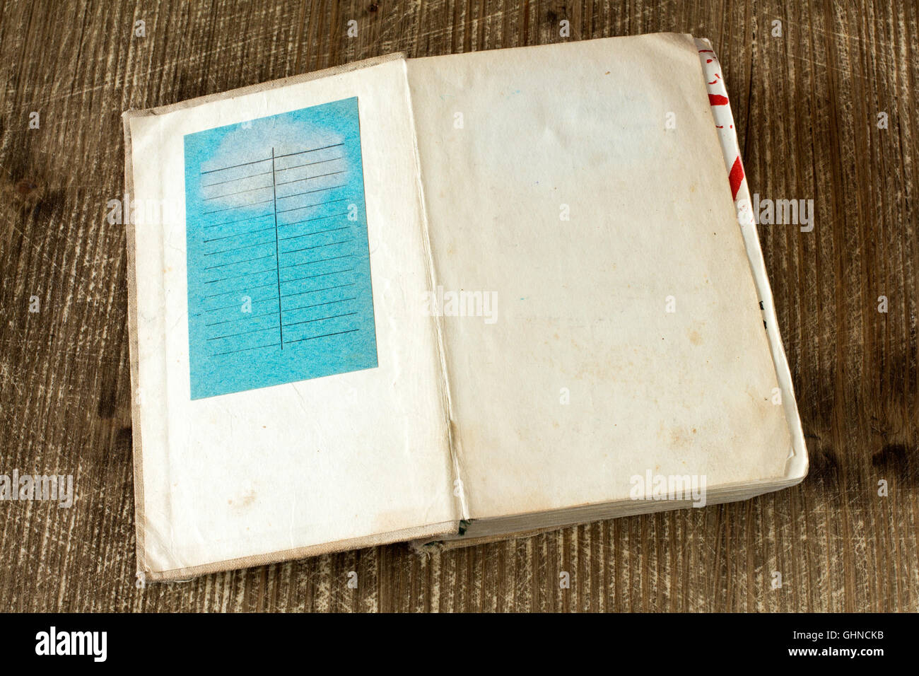First two pages of library book with a blue due date card Stock Photo ...