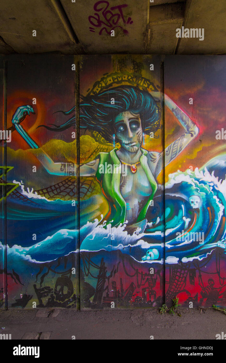 Graffiti mermaid spray painted onto a concrete underpass Stock Photo ...