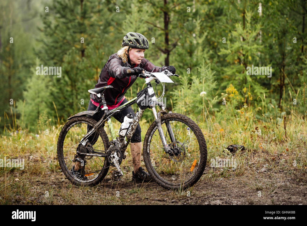 Blonde girl riding bike hi-res stock photography and images - Alamy