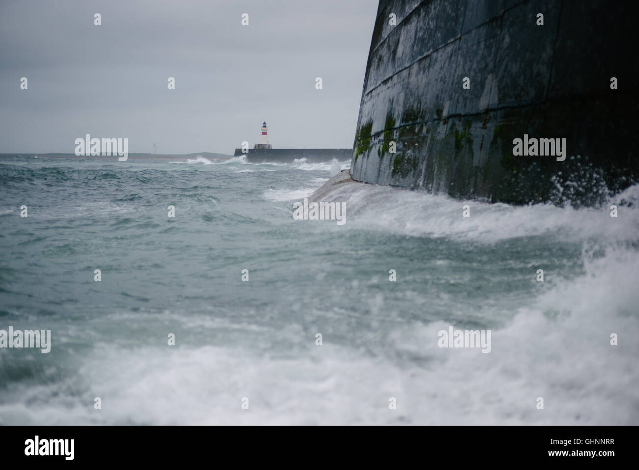 Stormy seascape showing Fraserburgh harbour wall and lighthouse in bad ...