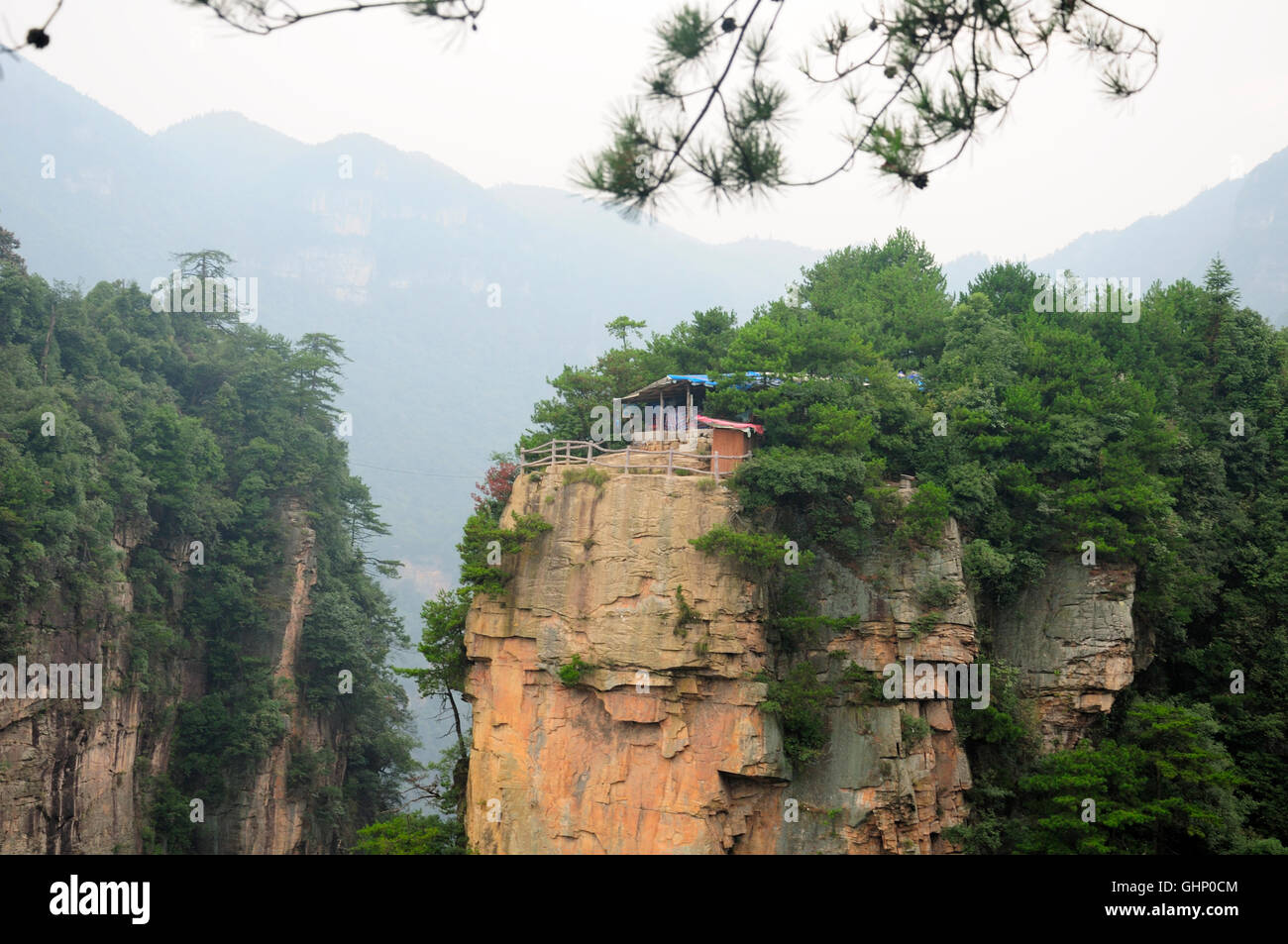 A covered food stand on a cliff within the Zhangjiajie national forest ...