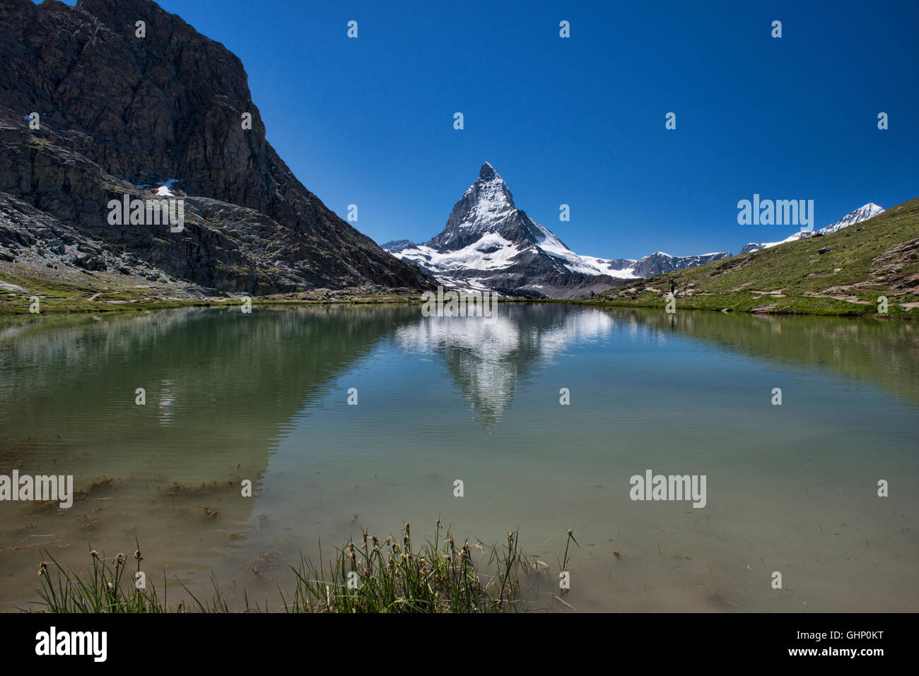 The Matterhorn reflected in the Riffelsee Lake, Zermatt, Switzerland ...