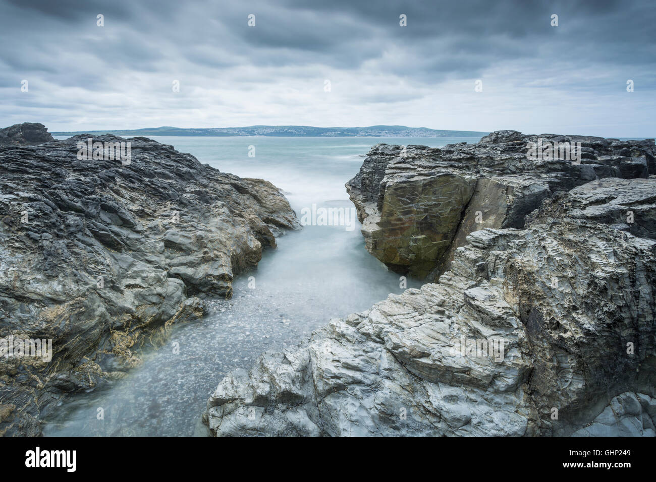 Long exposure of the rising tide on the rocks at Godrevy in North ...