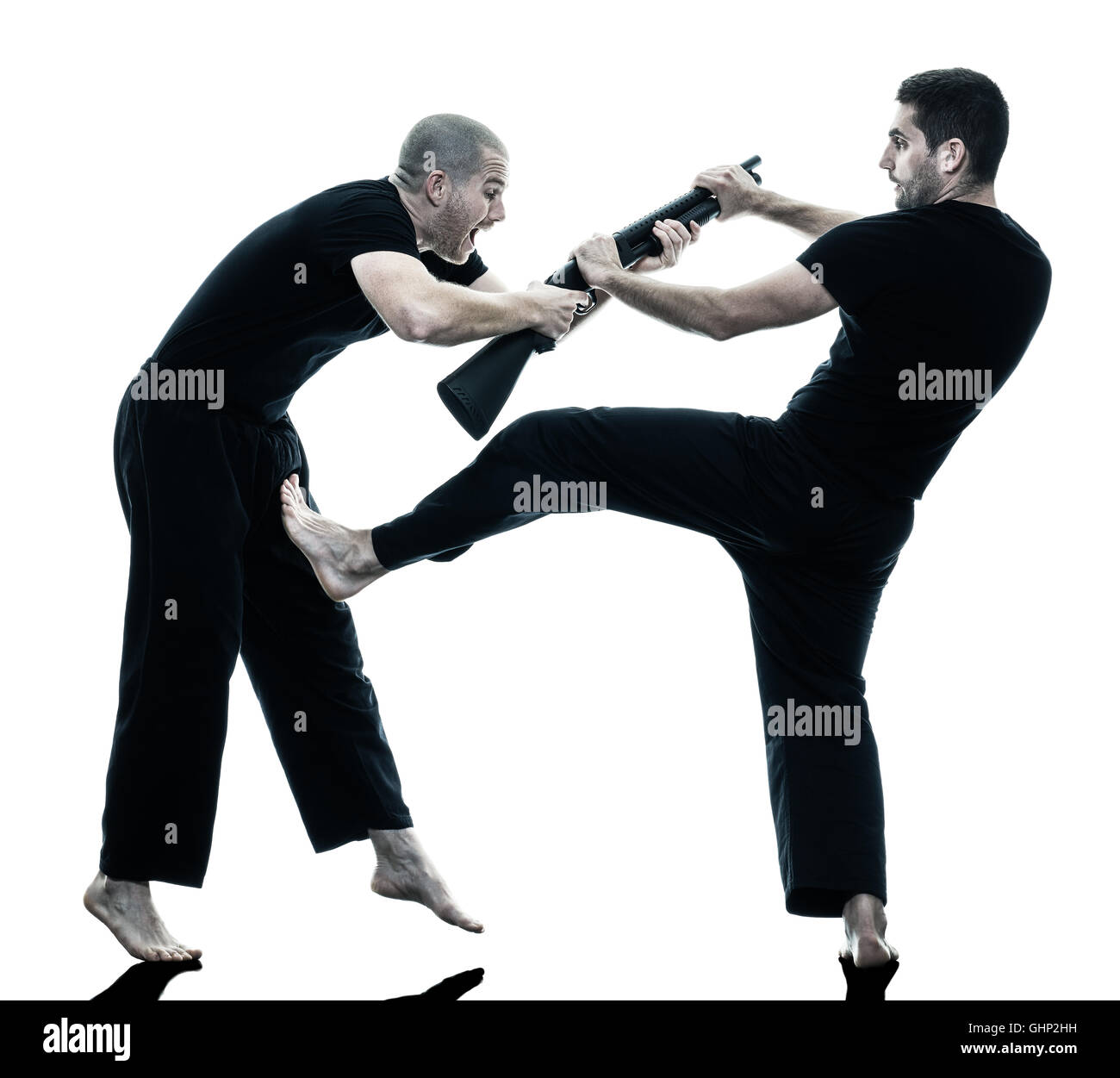 two caucasian men krav maga fighters fighting isolated silhouette on ...