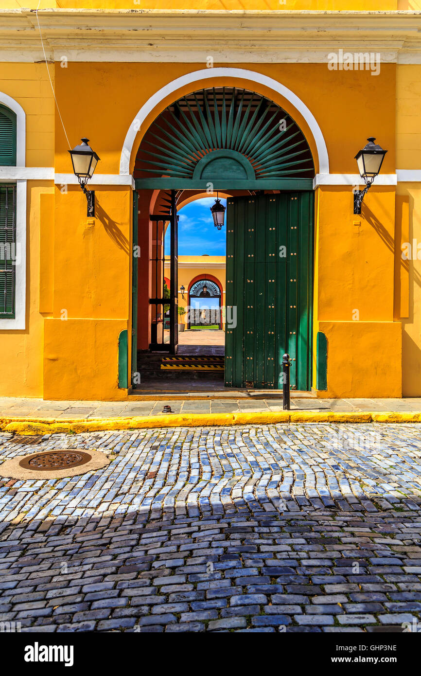 Colorful Colonial Building with Gigantic Door and Cobblestone Road ...