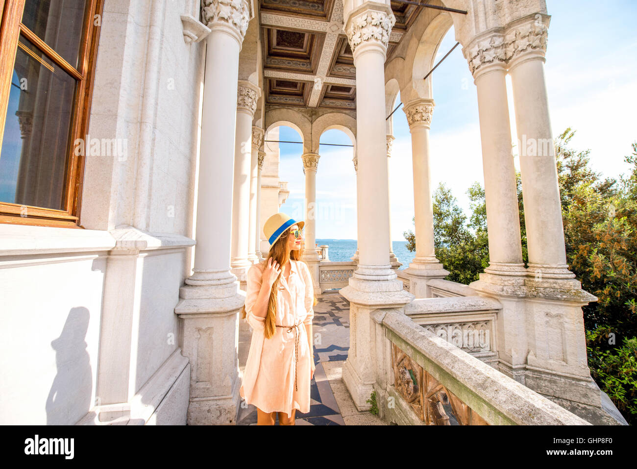 Young woman walking on terrace hi-res stock photography and images - Alamy