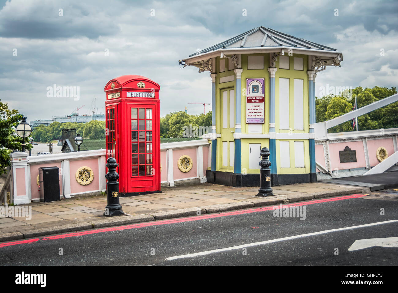 Red telephone box and toll-booth on the Albert Bridge, Chelsea, London ...