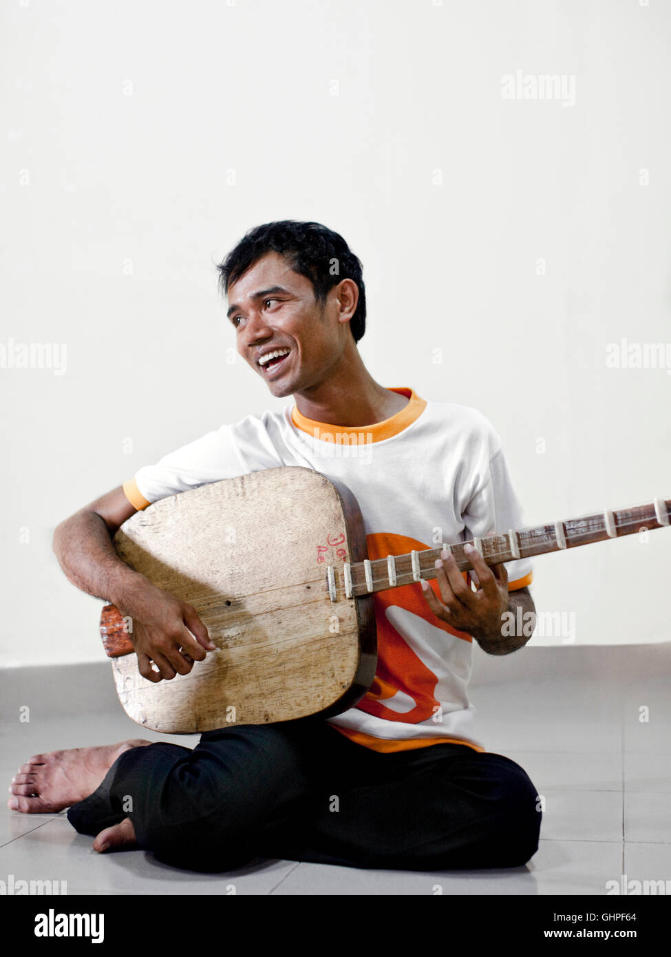 Chapei student Pitch Sarath practices his Chapei dang weng (a Cambodian ...