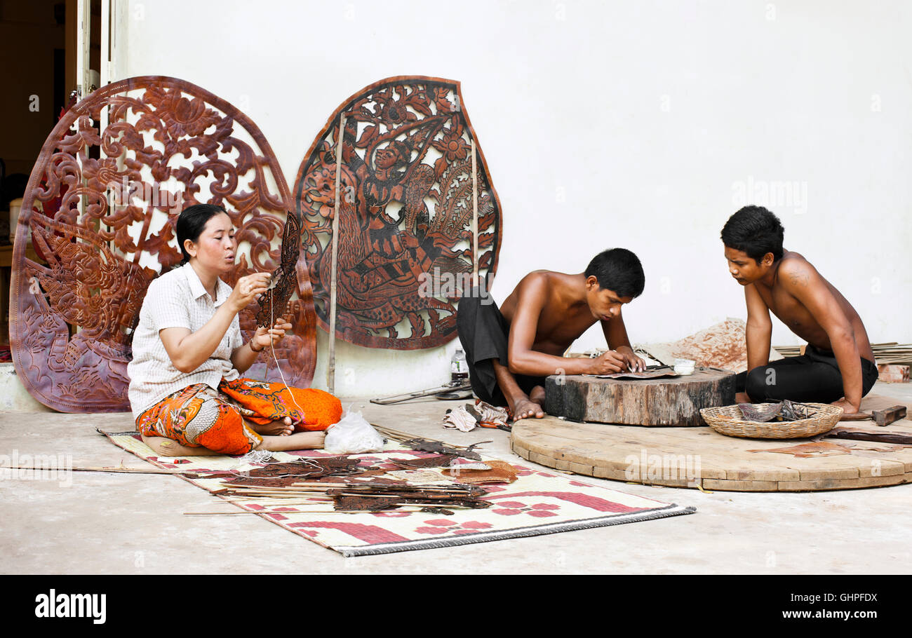 Artists from Cambodia Living Arts make shadow puppets at their home in ...