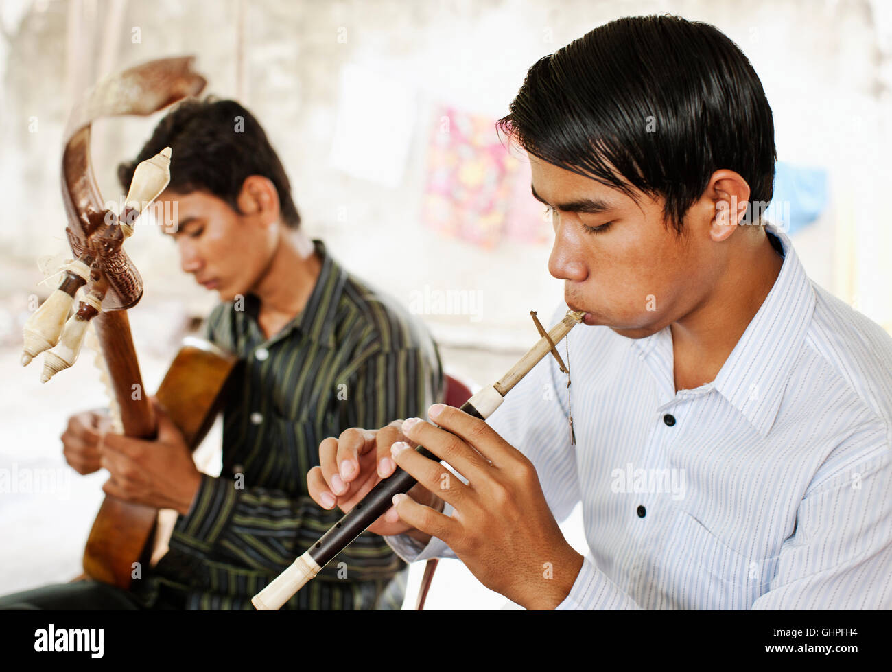 Sralai (right) and Chapei (left ) students practice traitional Khmer ...