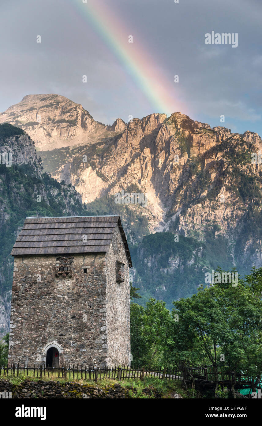 The Kulla, lock-in tower at Theth, with the Albanian Alps in the ...