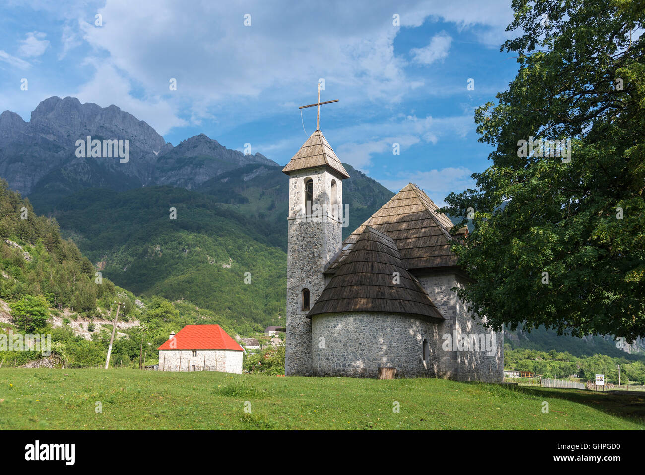 The village of Theth, with its shingle roofed church, Northern Albania ...