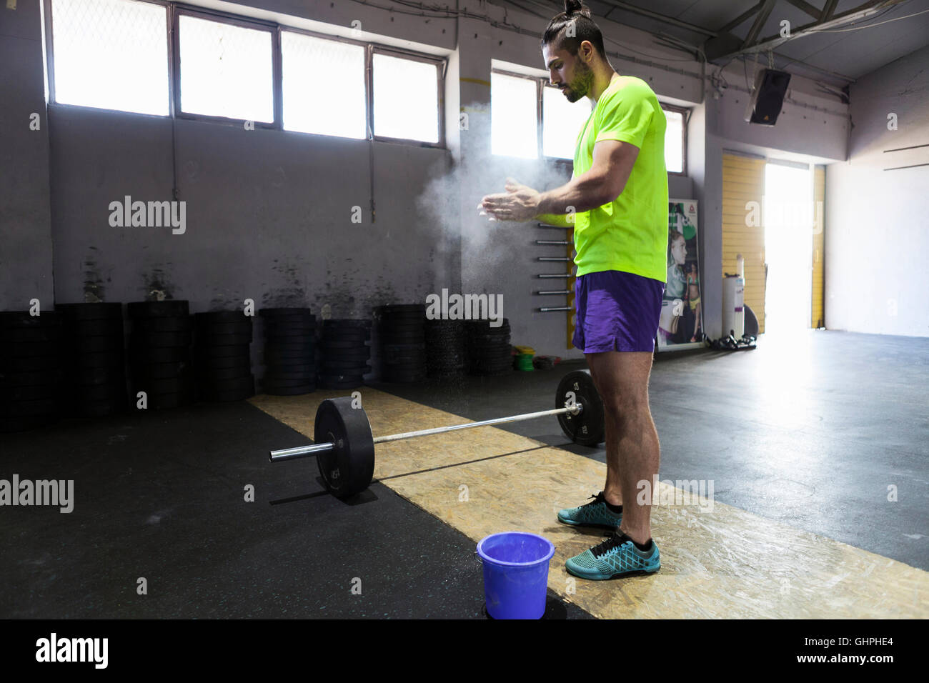 Athlete in gym prepares for weightlifting Stock Photo - Alamy