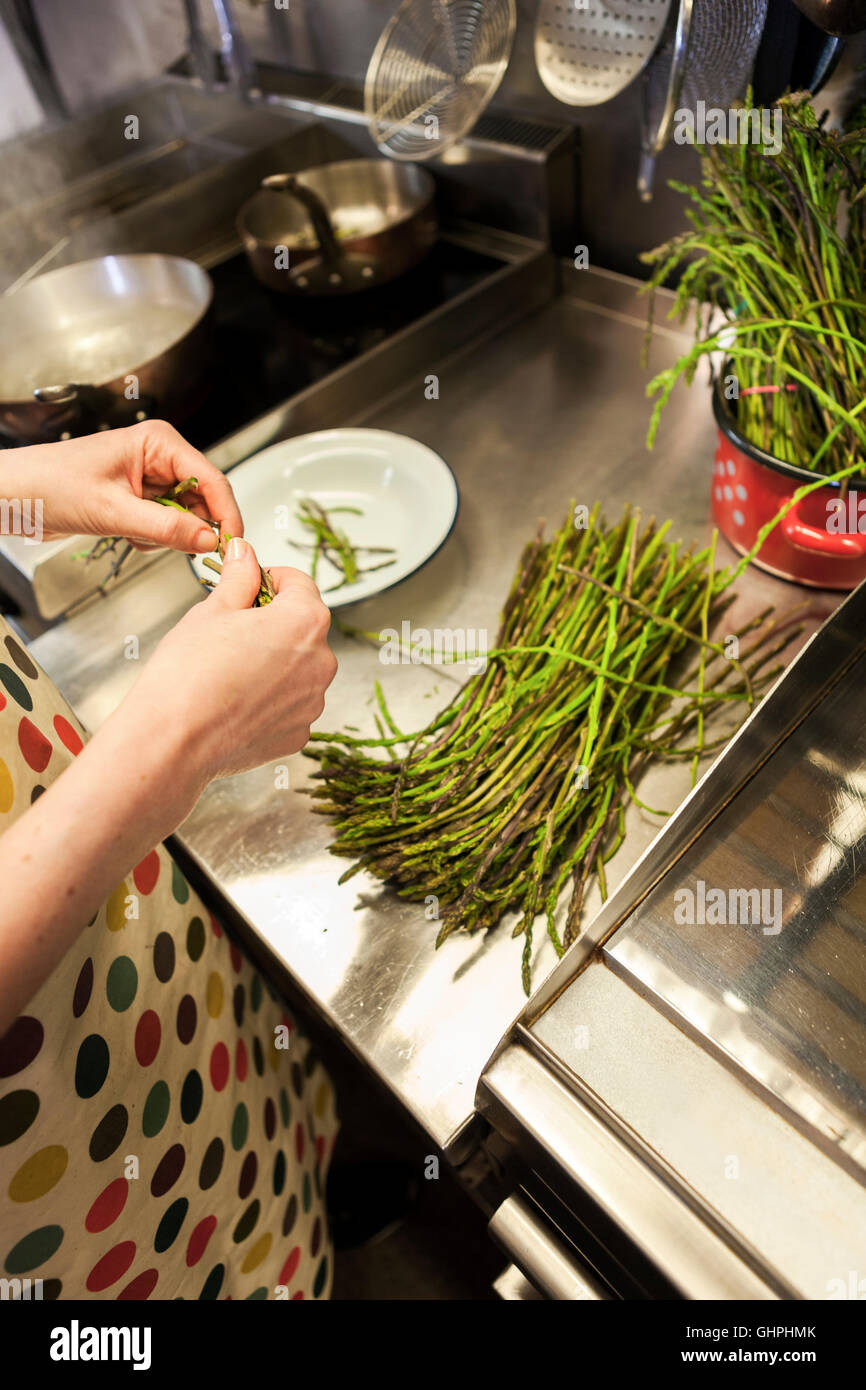 Female chef preparing bean dish Stock Photo - Alamy