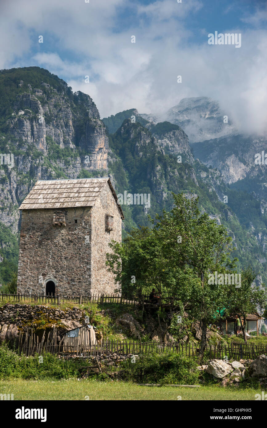 The Kulla, lock-in tower at Theth, with the Albanian Alps in the ...