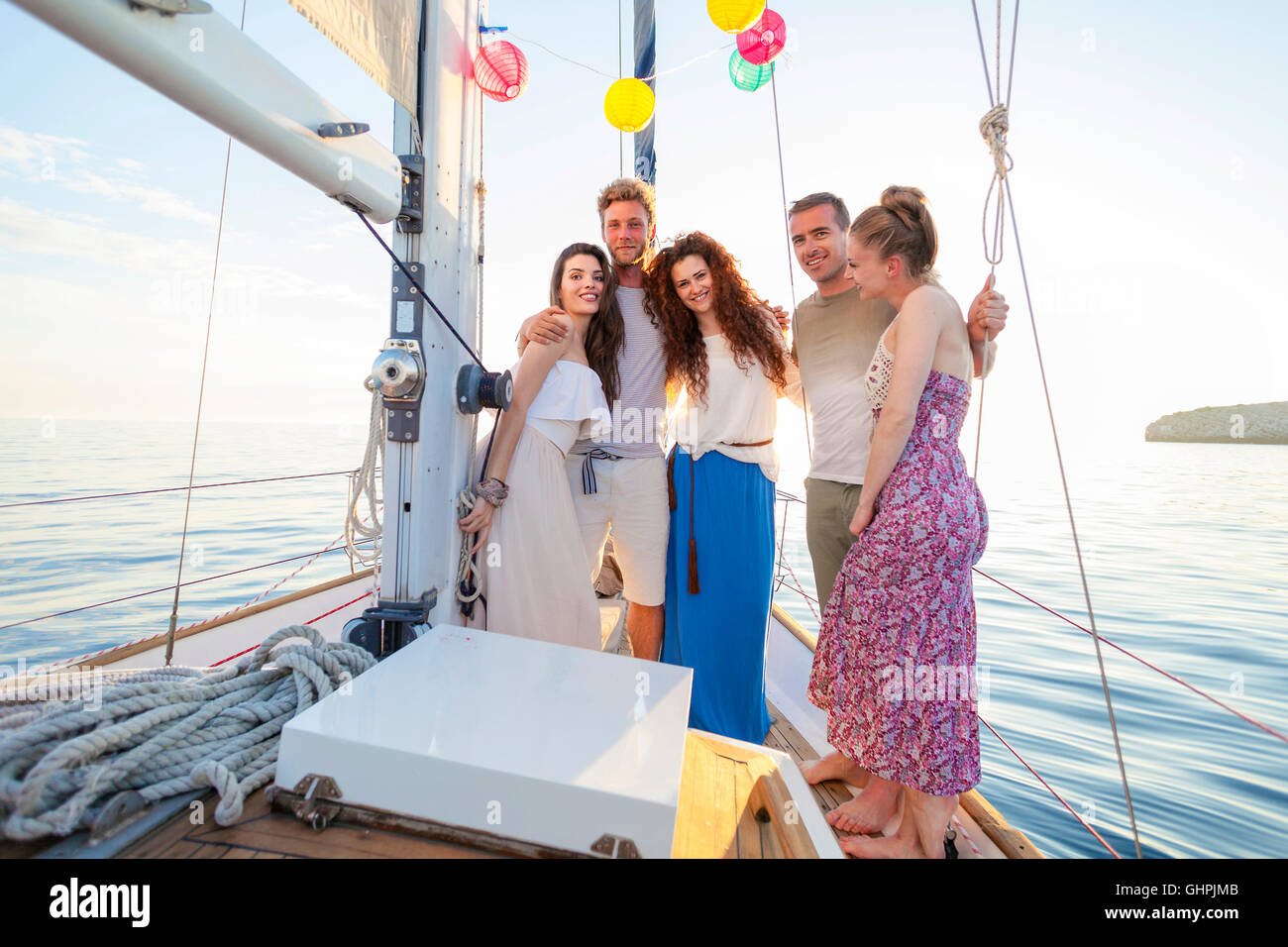 Group of friends on sailboat Stock Photo - Alamy