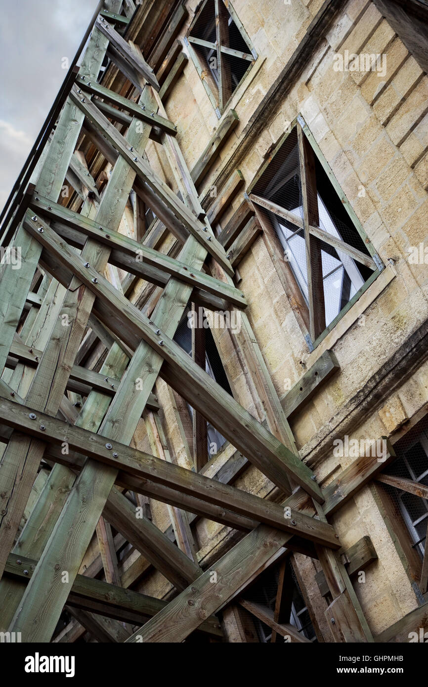 Wooden structure to preserve a facade of an old house Stock Photo - Alamy