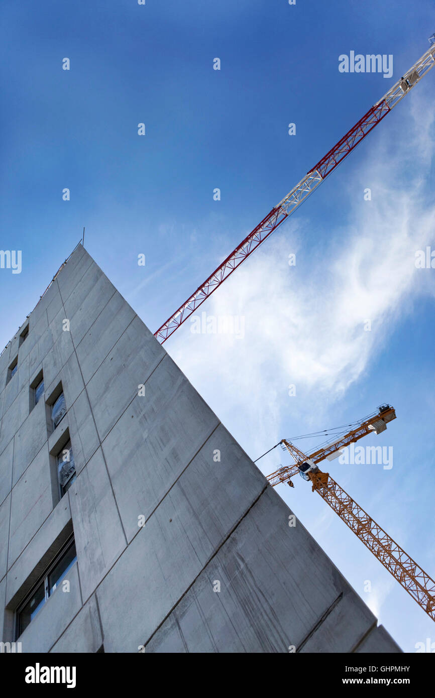 Cranes and concrete building on a construction site in France Stock ...