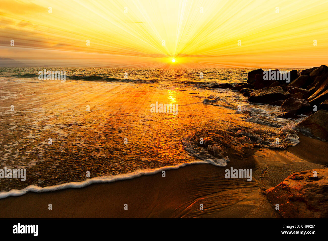 Ocean sunset sun rays is a colorful ocean scenic with sun beams ...