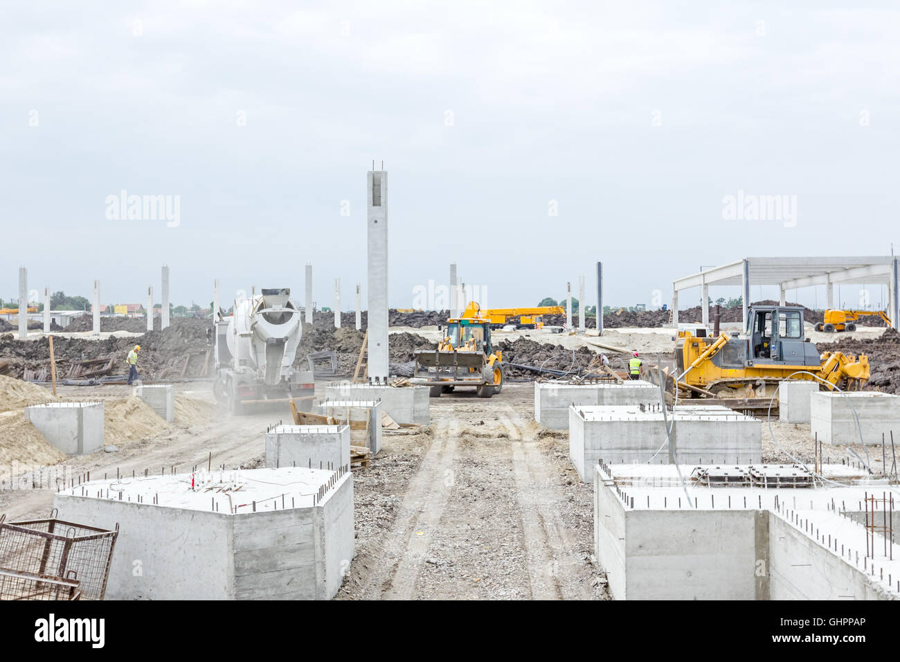 Concrete base of new edifice with reinforcement at building site is ...