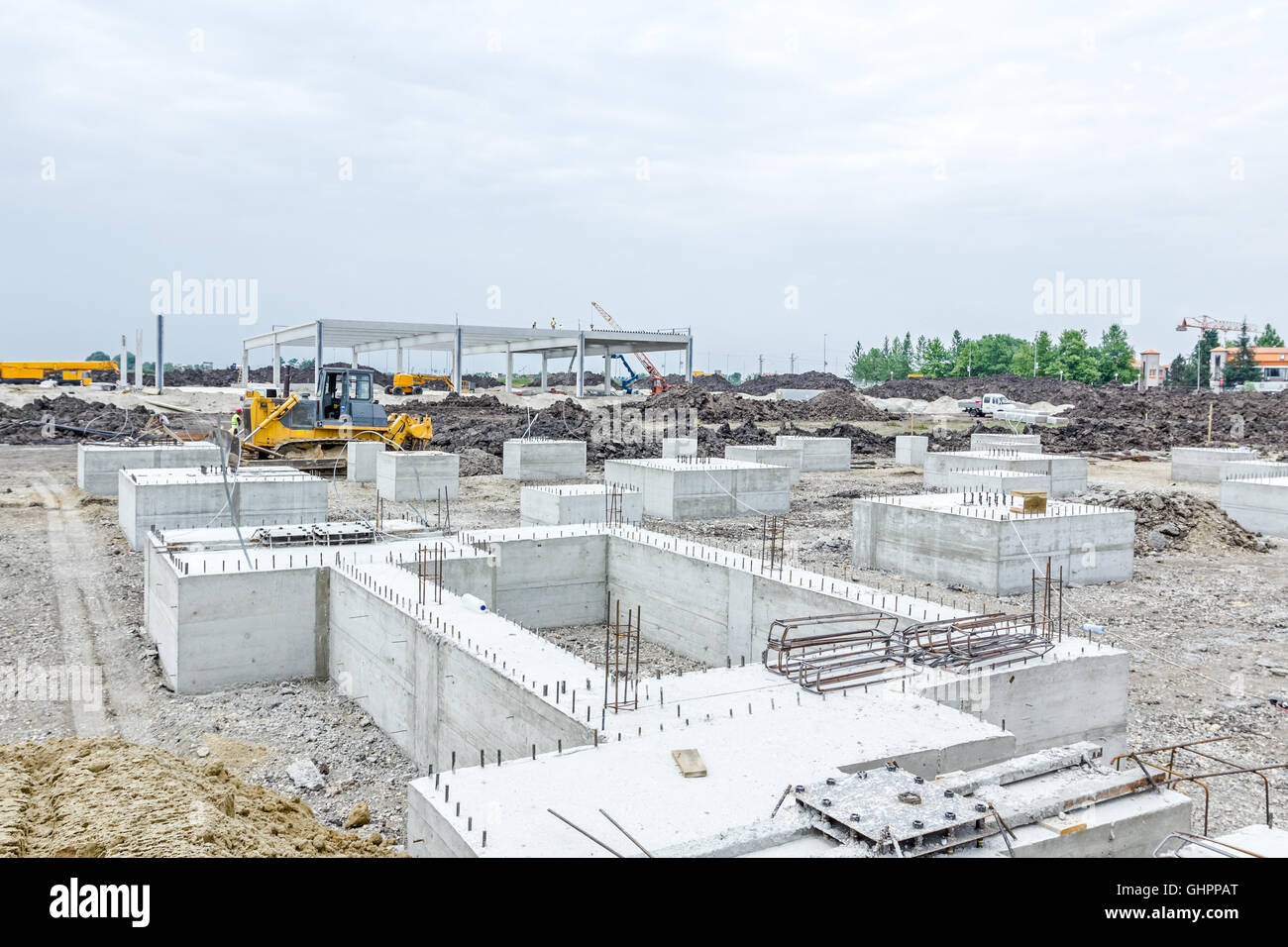 Concrete base of new edifice with reinforcement at building site is ...