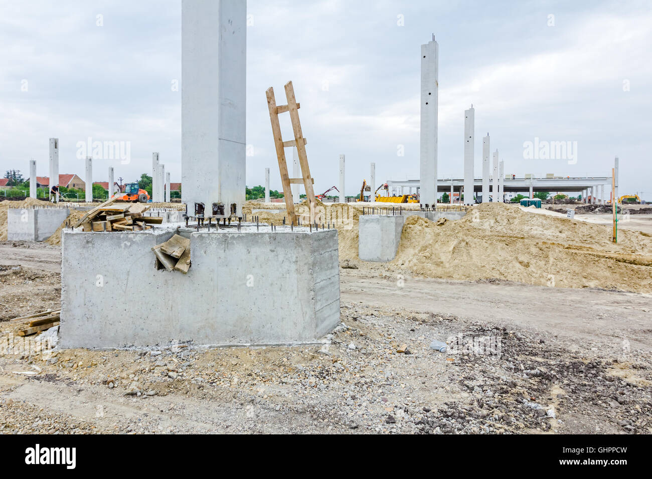 Workers are used wooden ladder at construction site. Reinforced steel ...