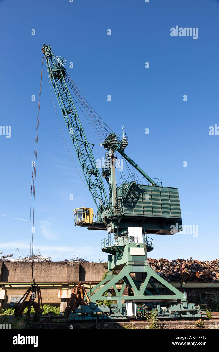 Bulk handling crane at the industrial port Stock Photo - Alamy