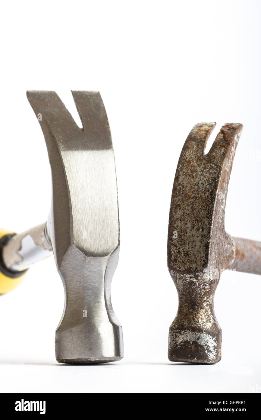 Two hammers, one old one new on a white background Stock Photo - Alamy
