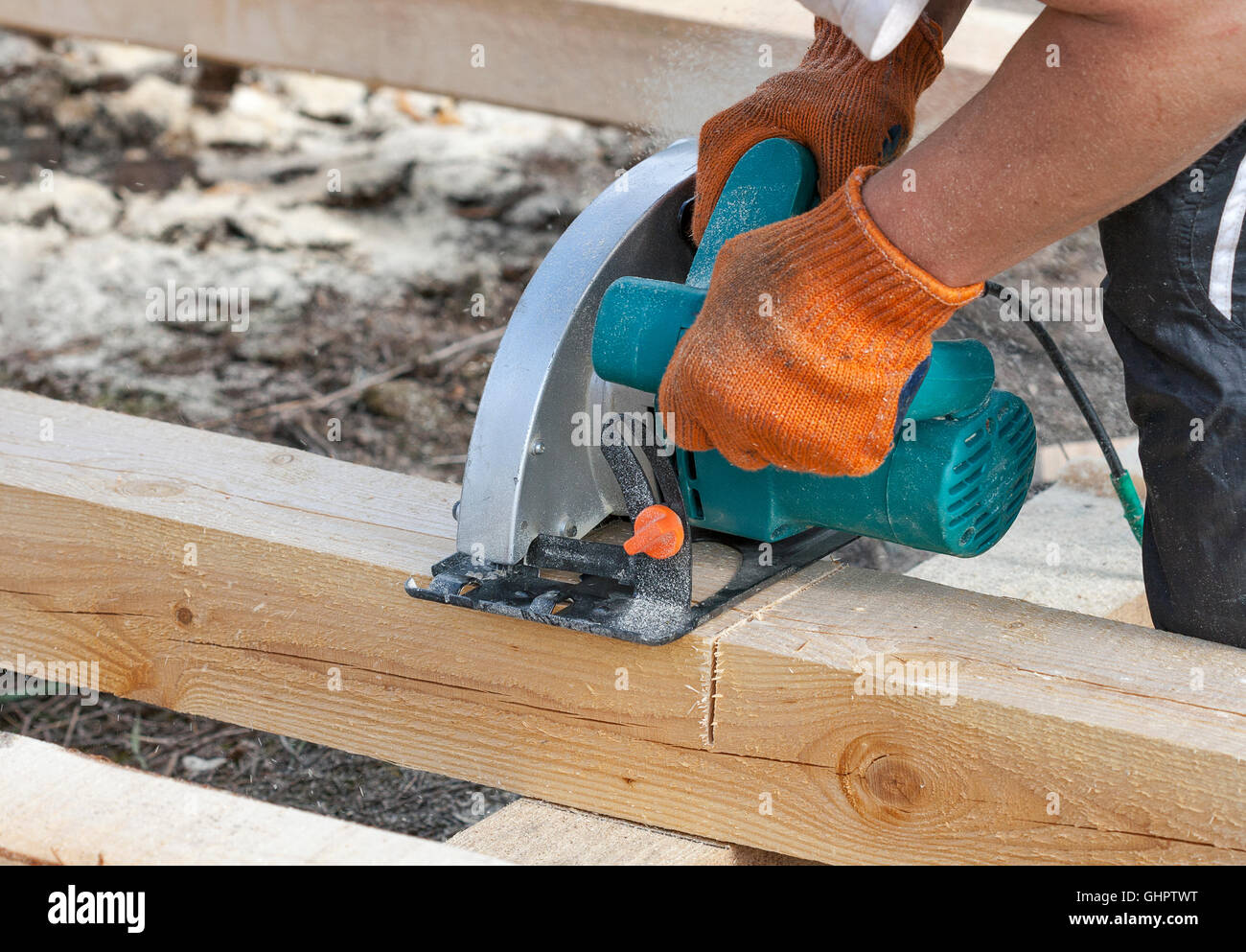 Carpenter working with circular saws closeup Stock Photo - Alamy