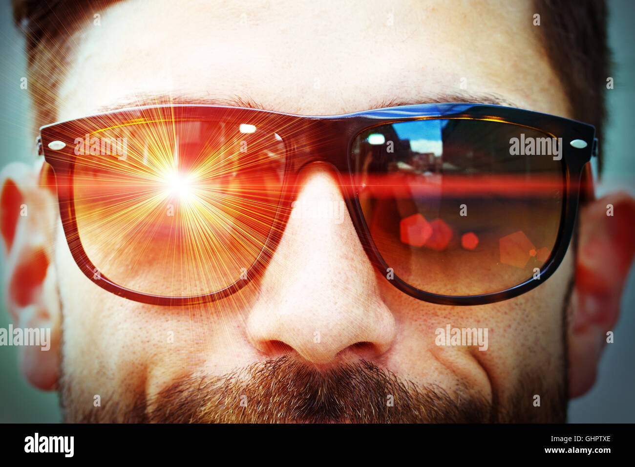 Man with sunglasses and red laser ray Stock Photo - Alamy