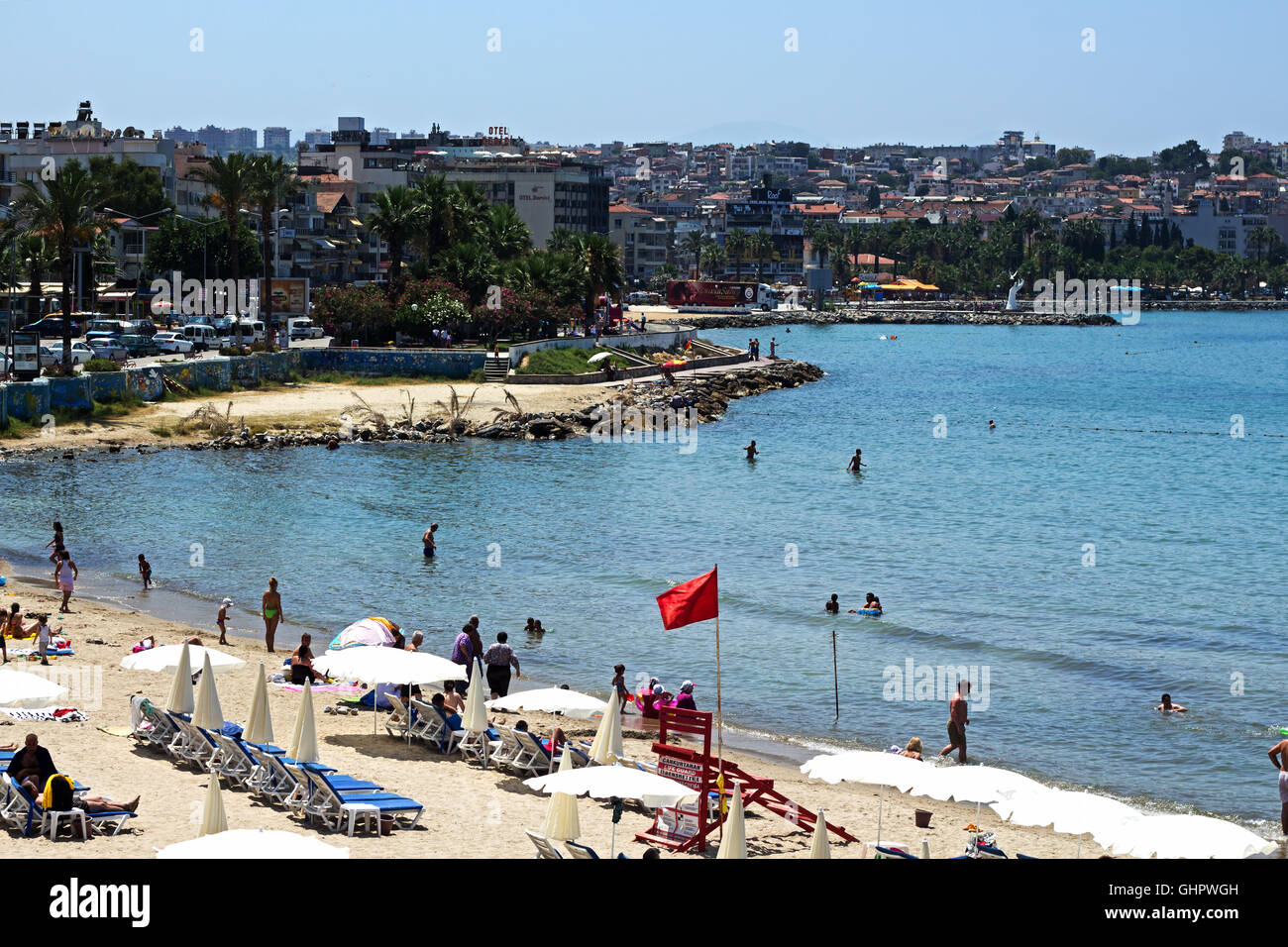 People sunbathing and swimming in Kusadasi Turkey Stock Photo - Alamy