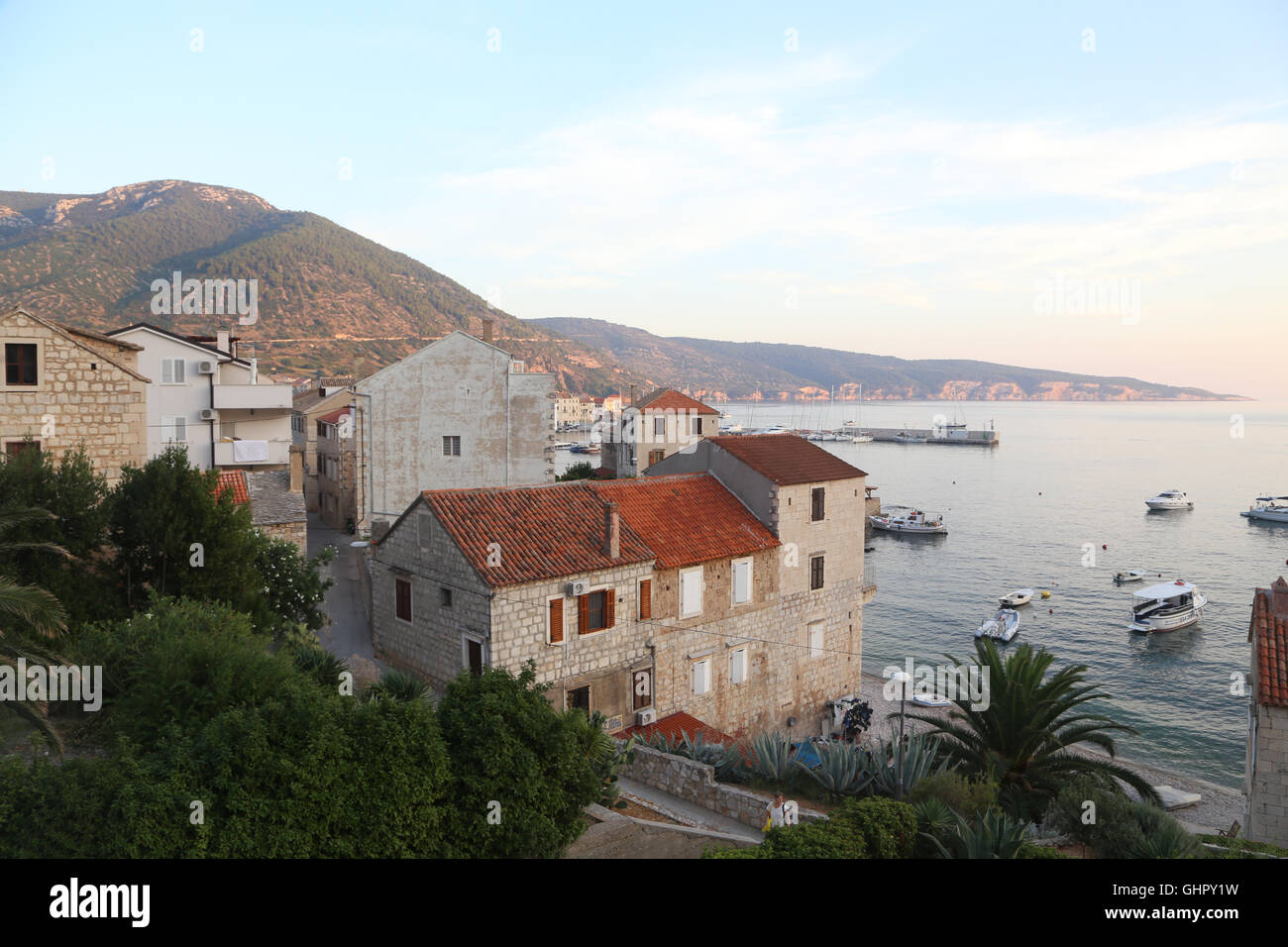 View of the harbor in Komiža on the island of Vis, Croatia Stock Photo ...