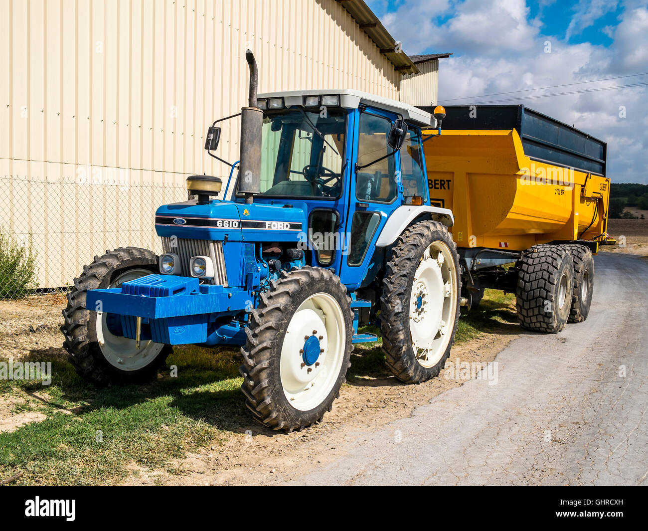 Ford 6610 farm tractor and grain trailer - France Stock Photo - Alamy