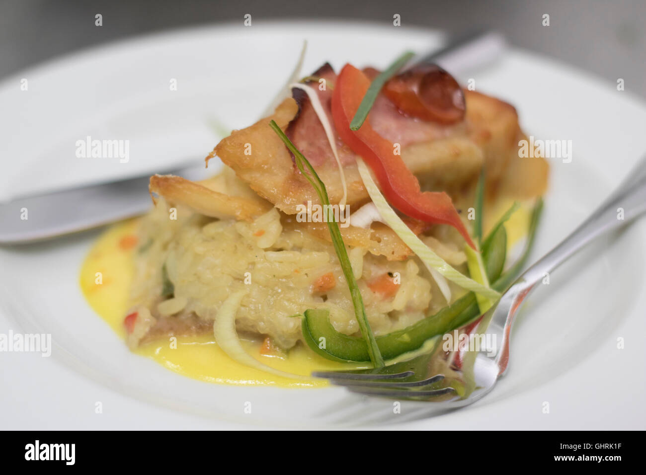 Zander with rice and sauce Stock Photo - Alamy