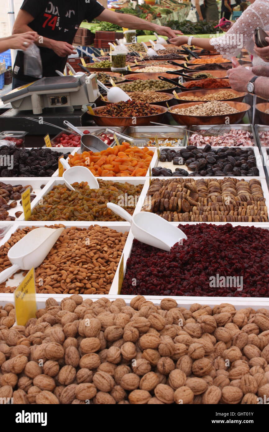 Nuts and other snacks on sale at a market in Pezenas, France Stock ...