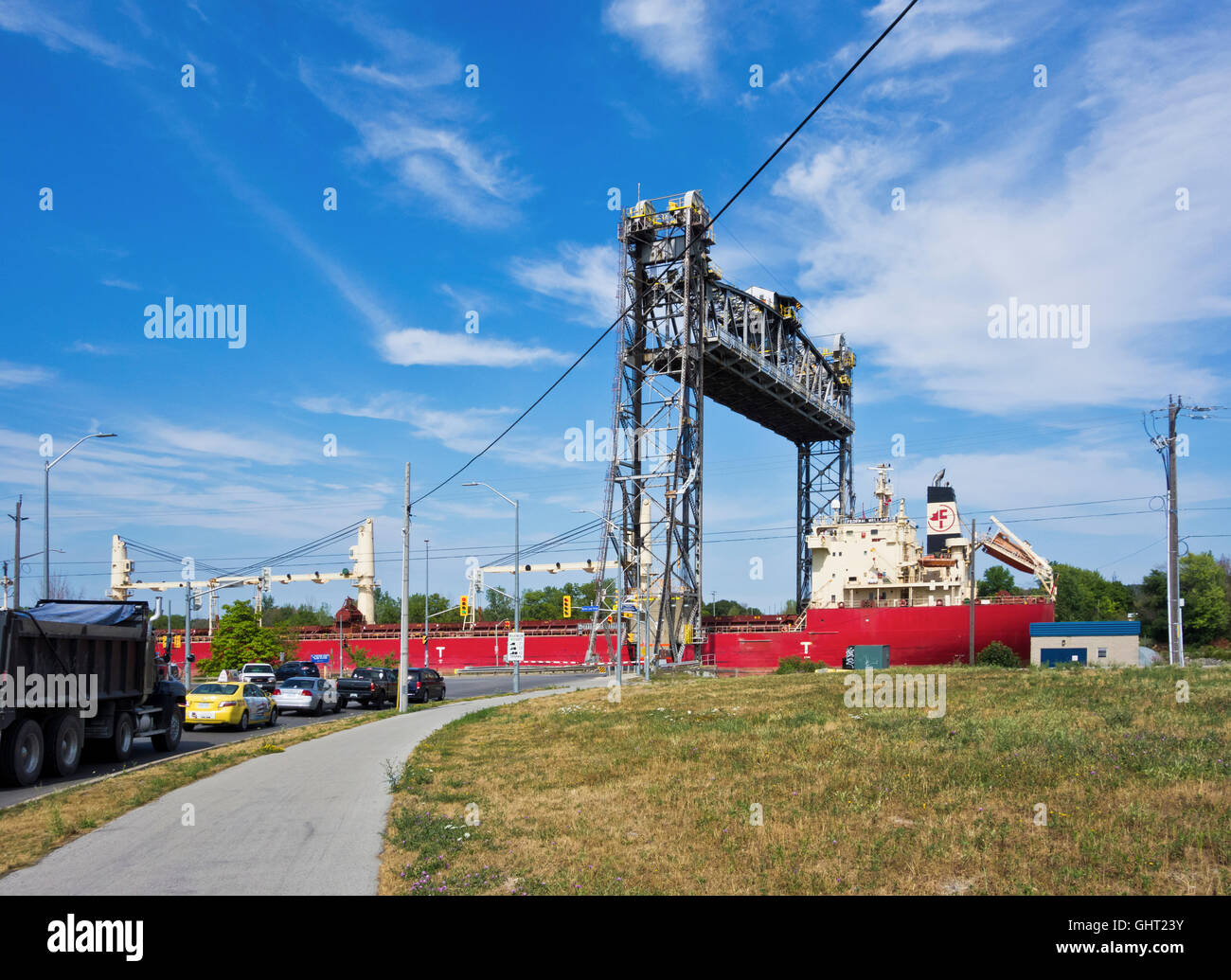 Ship passing through the vertical lift bridge of the Welland Canal in ...