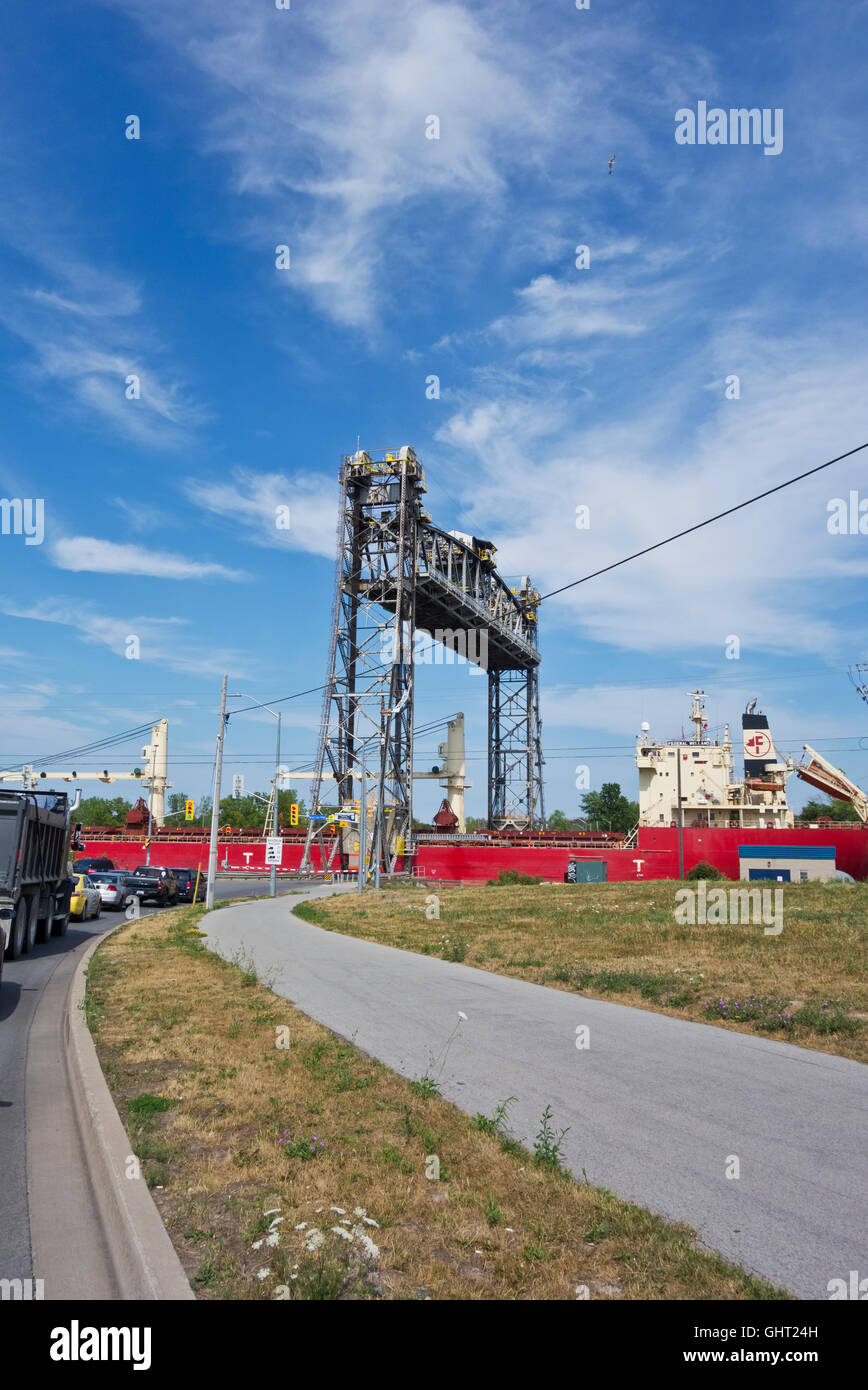 Ship passing through the vertical lift bridge of the Welland Canal in ...