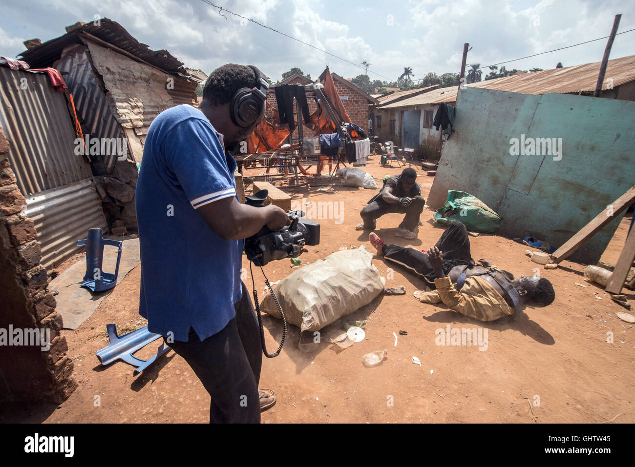 Director Isaac Nabwana (l) filming a fight scene with actors Bulyahika ...