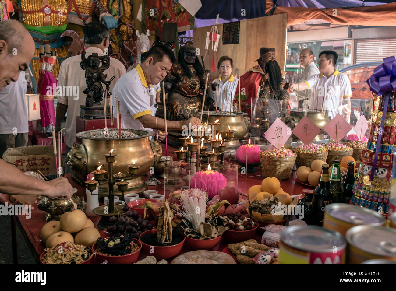 Kuala Lumpur, Malaysia. 11th Aug, 2016. Temple members setting up food ...