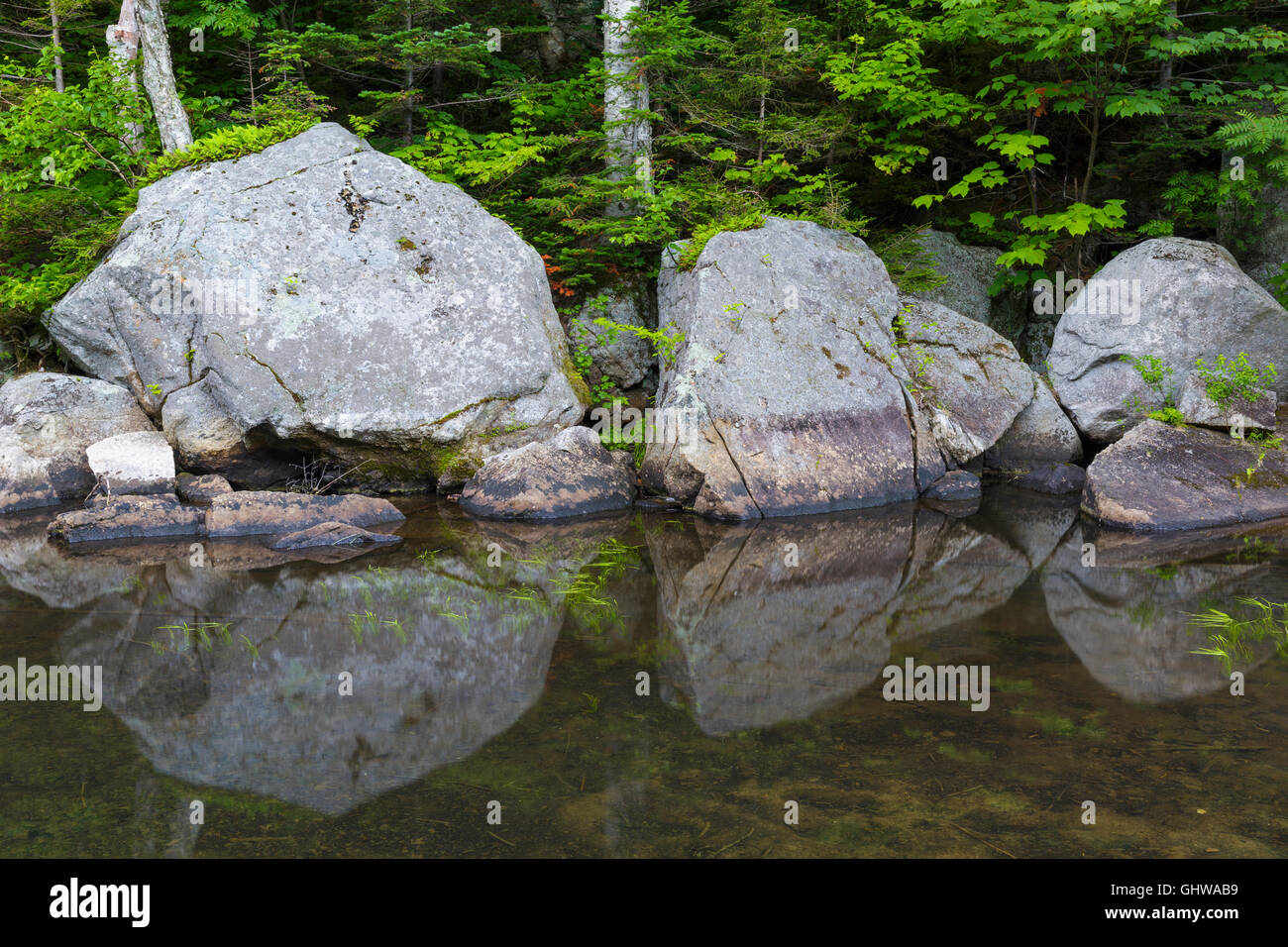 Reflection of rocks in Profile Lake in Franconia Notch State Park of ...