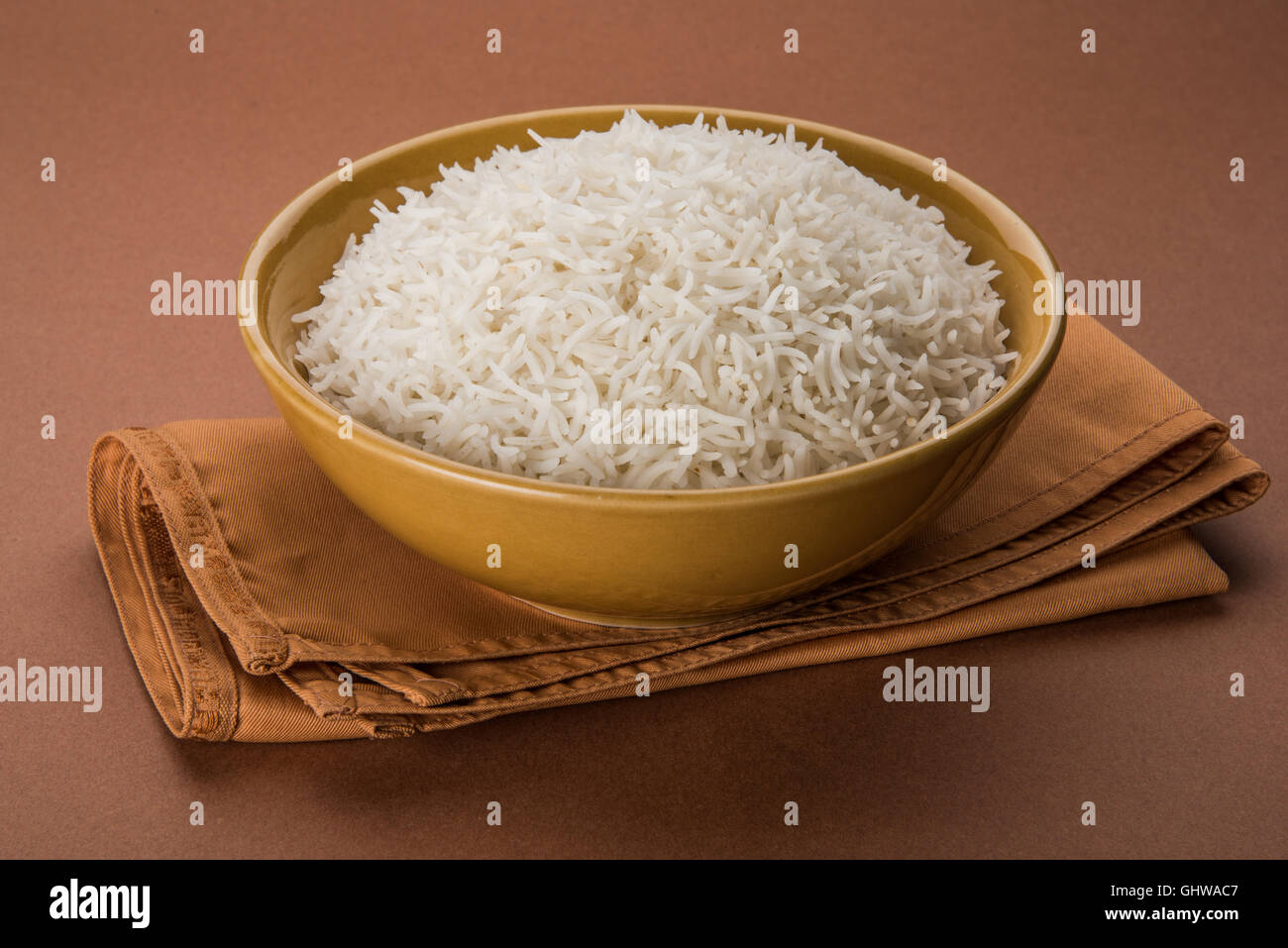 basmati rice in a brass bowl, cooked basmati rice, cooked plain rice ...