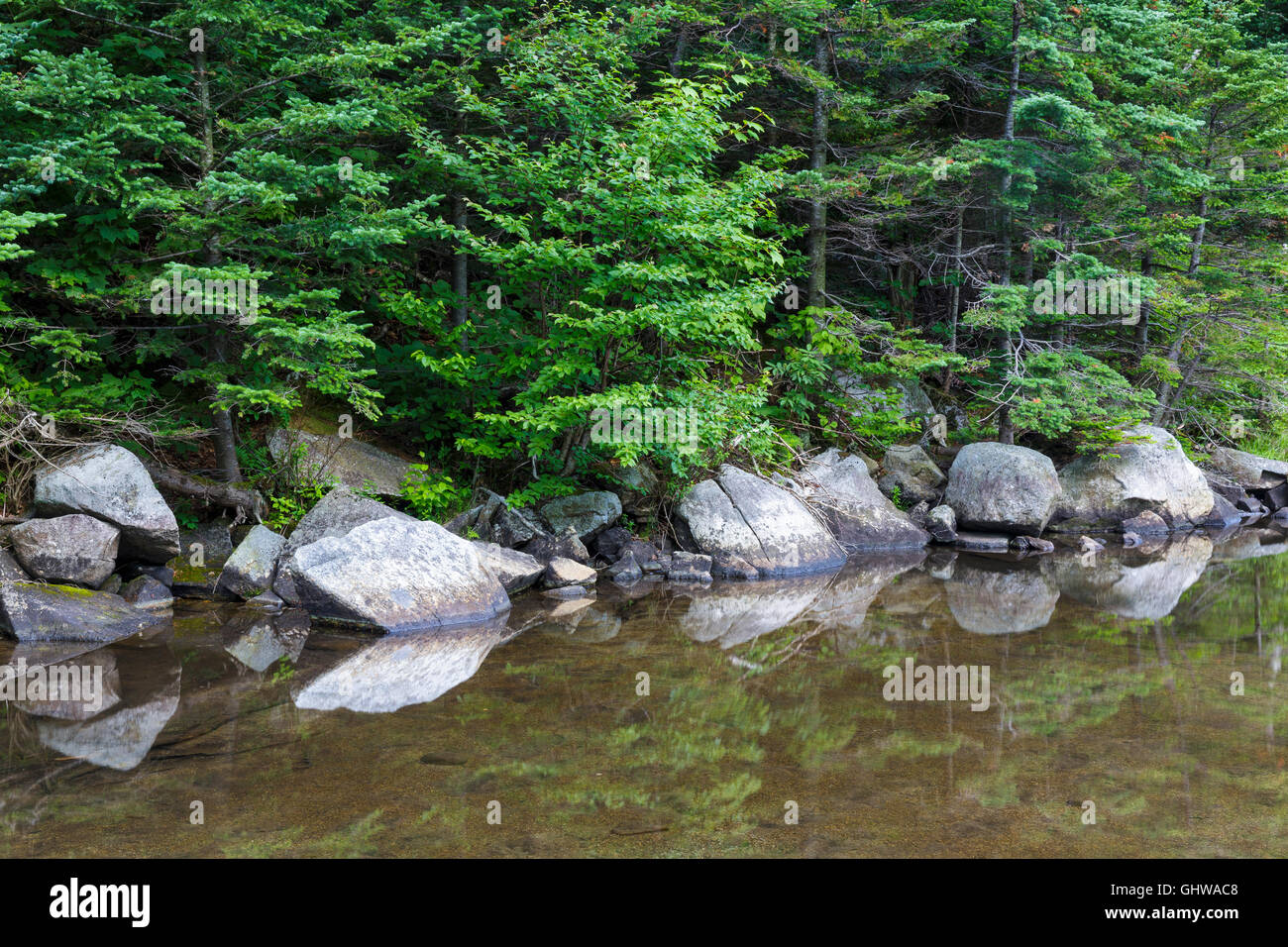 Reflection of rocks in Profile Lake in Franconia Notch State Park of ...
