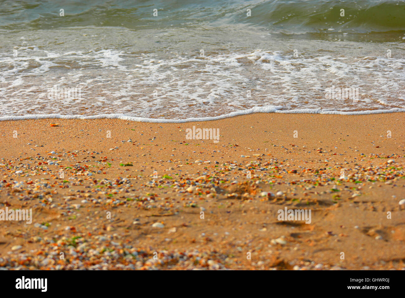 Wave of the sea on the sand beach Stock Photo - Alamy