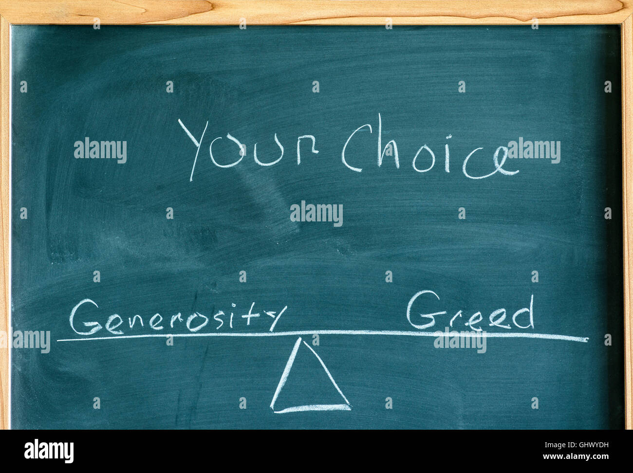 the words generosity and greed on a scale in equilibrium written on a ...