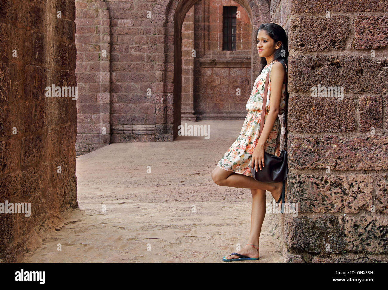 Young asian girl by brick wall hi-res stock photography and images - Alamy