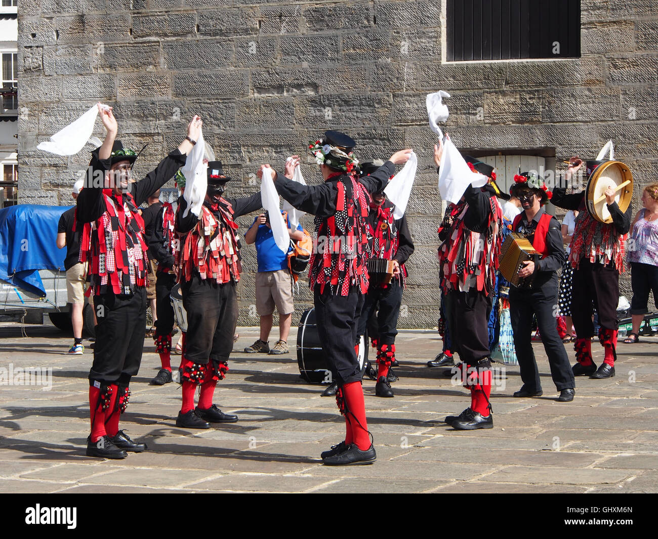 traditional Morris dancers dancing outside of the Square tower in old ...