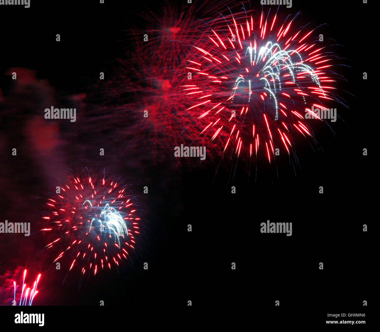 show with red flowers colorful fireworks in the dark sky Stock Photo ...