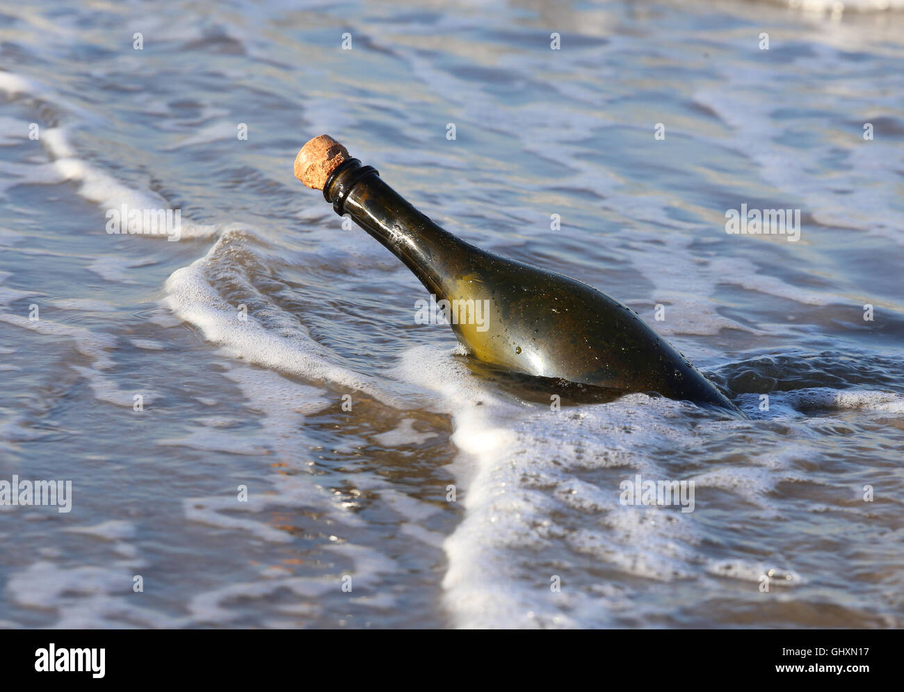 Secret Message in the glass bottle on the beach of sea Stock Photo - Alamy