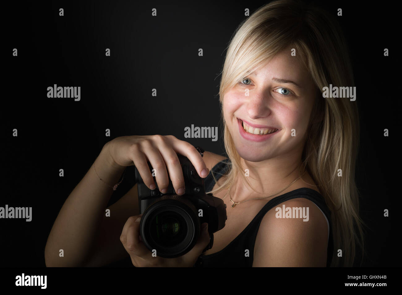 pretty young woman with camera Stock Photo - Alamy