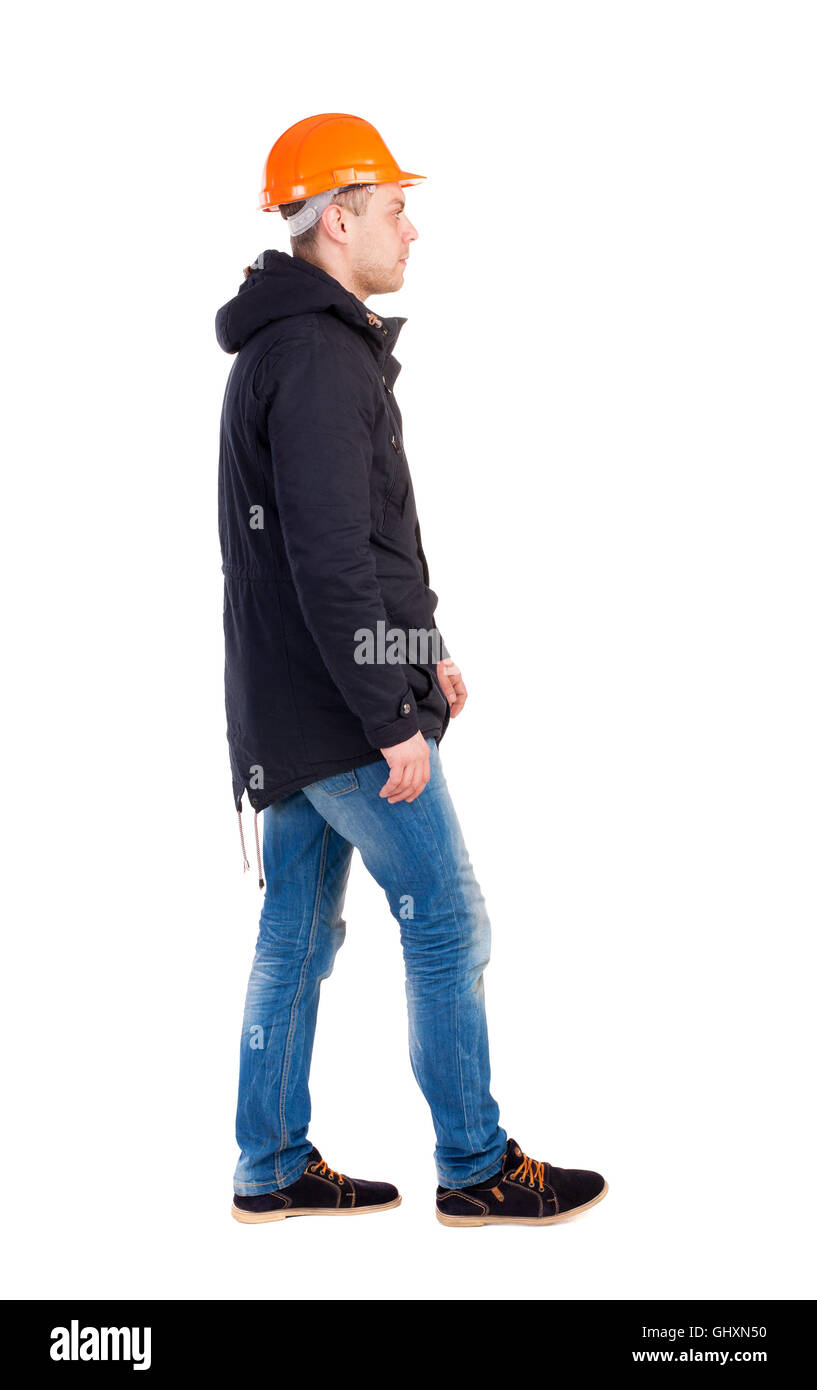 Back view of walking engineer in helmet Stock Photo - Alamy